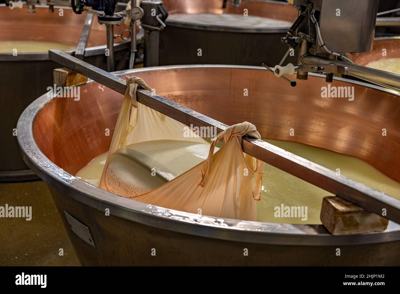 Process of making parmesan cheese from curds in the factory Stock Photo ...