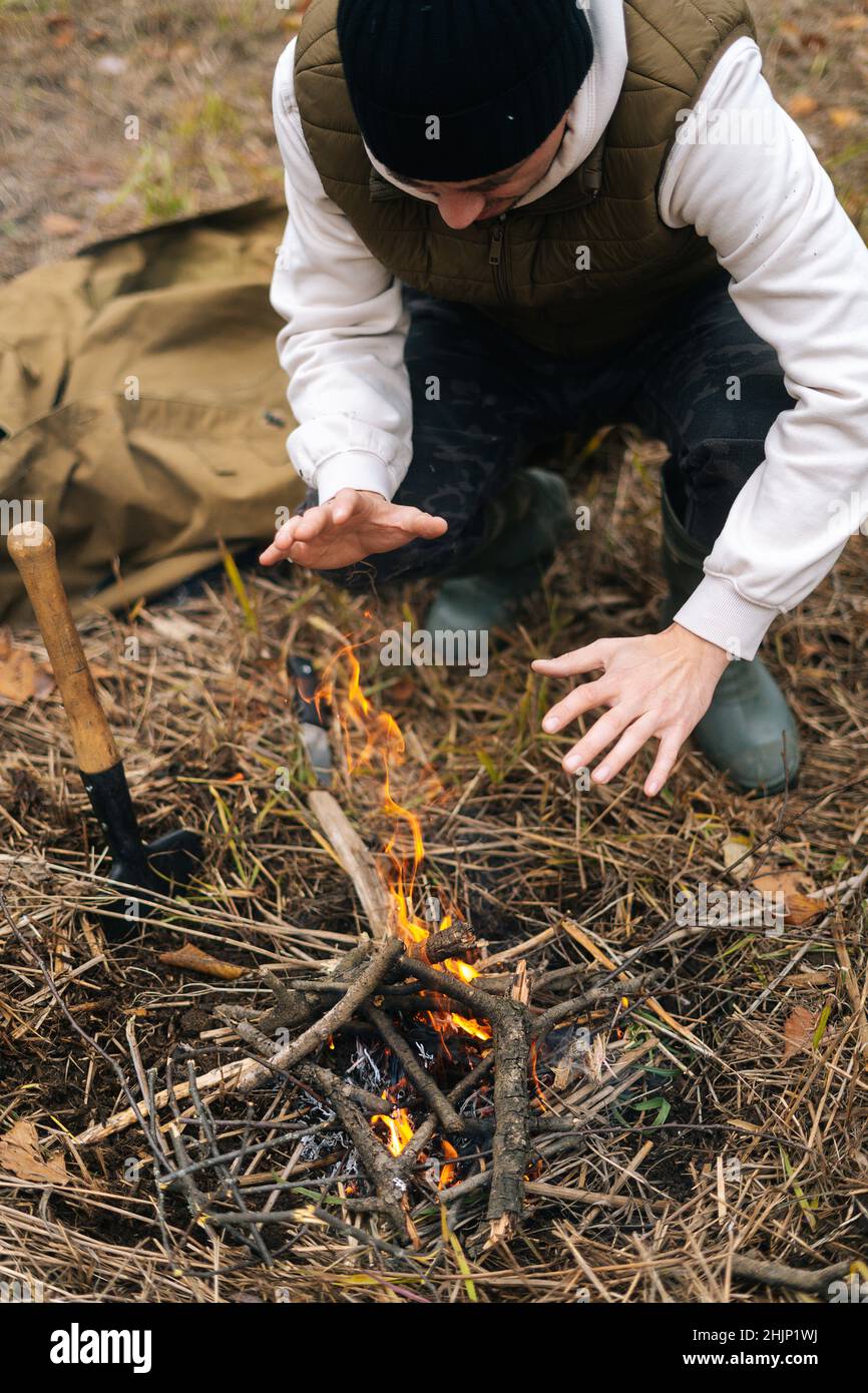 Warming hands by fire hi-res stock photography and images - Alamy