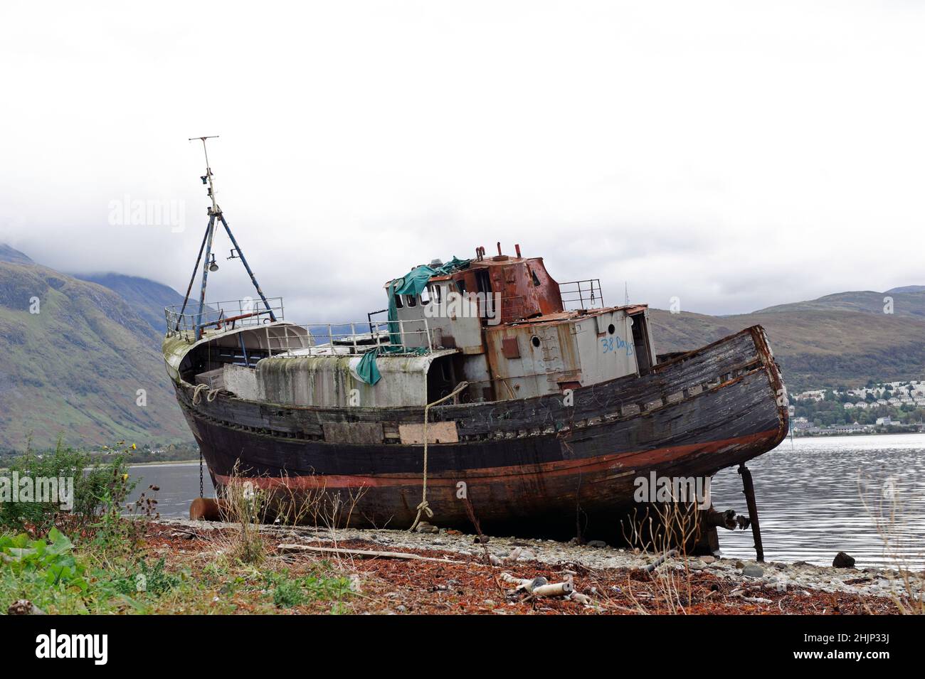 The Old fishing boat on the shingled shoreline of Loch Linnhe near Fort ...