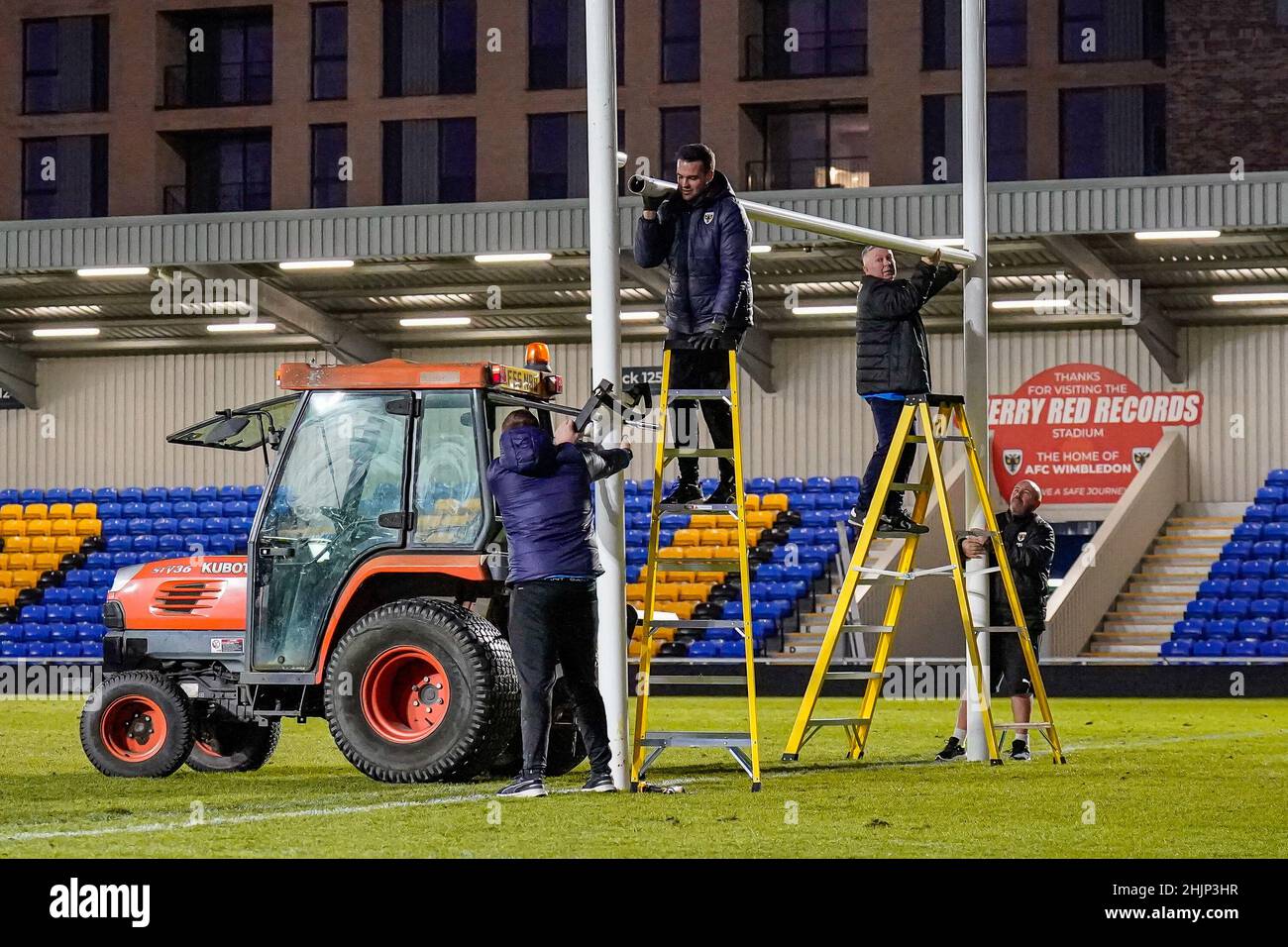 Wimbledon, UK. 19th Jan, 2022. Ground staff dismantle the rugby posts ...