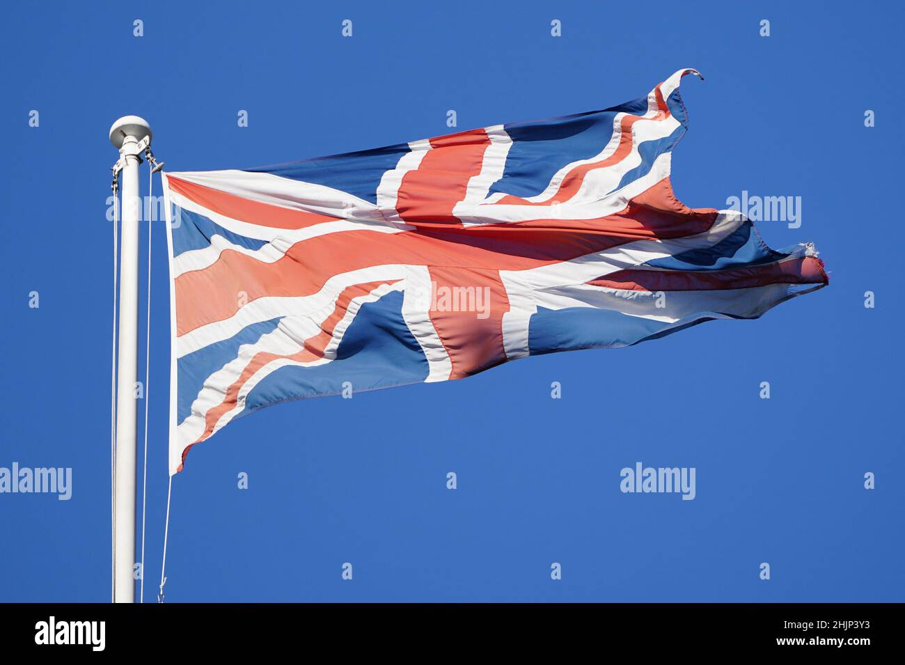 The sun shines on the Union flag in Downing Street, London, as it ...