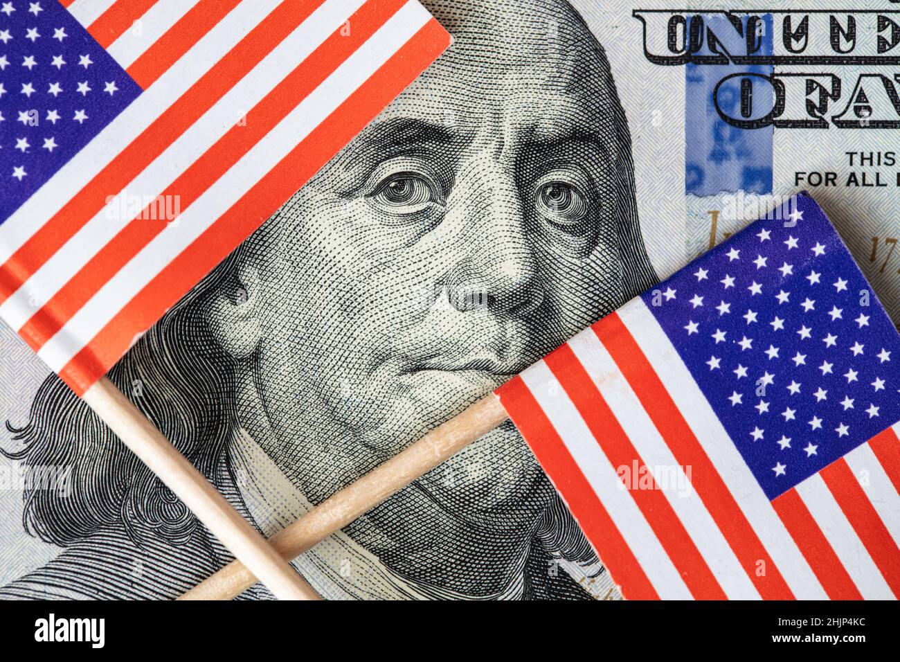 U.S. 100 dollar banknote on american flag background for design purpose ...