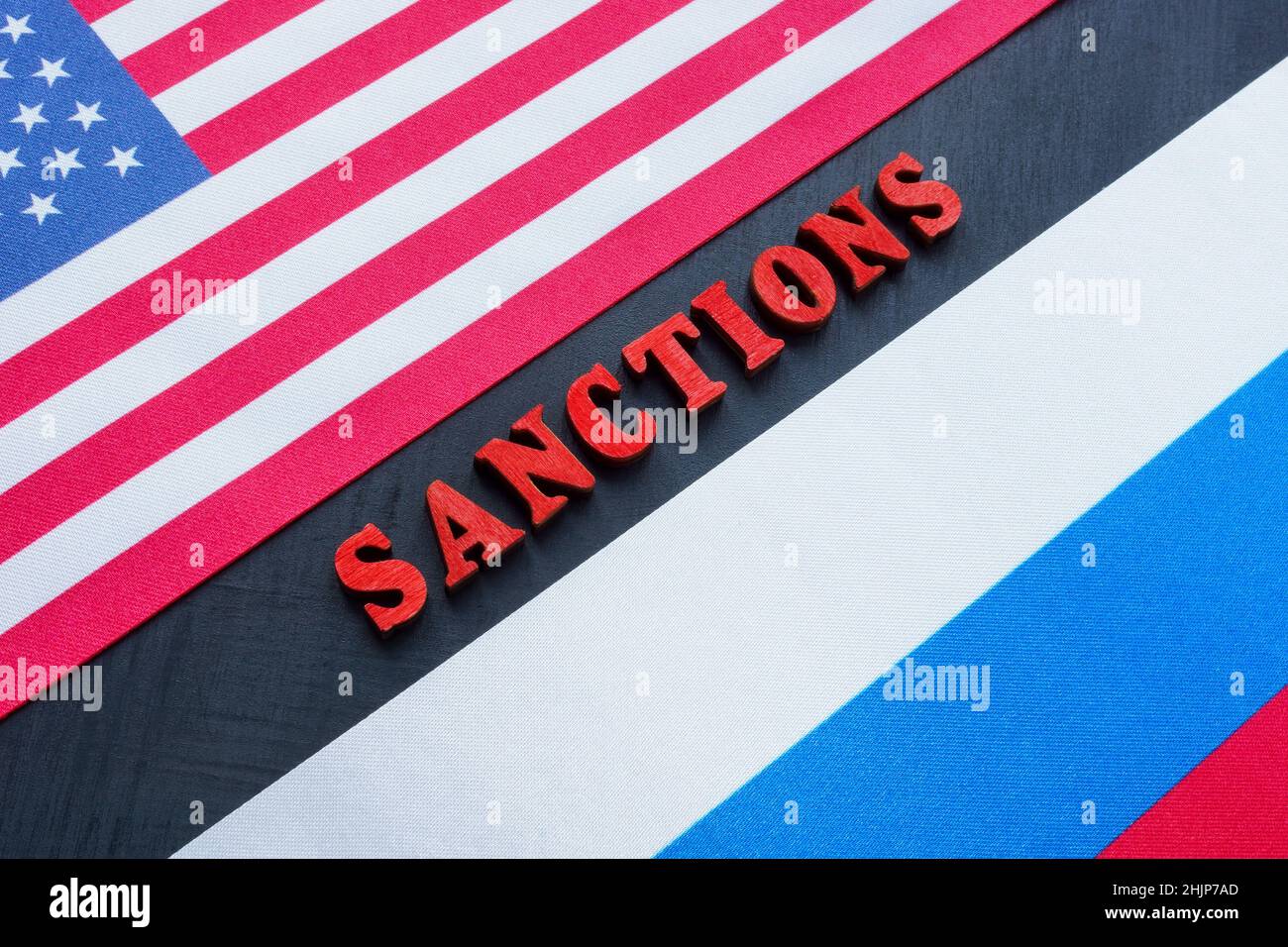 Word Sanctions and flag of USA and Russia Stock Photo - Alamy