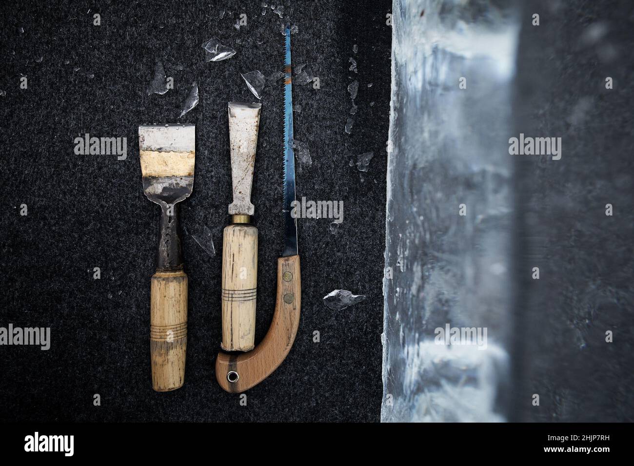 Top view of Ice tools next to an ice block outdoors Stock Photo - Alamy