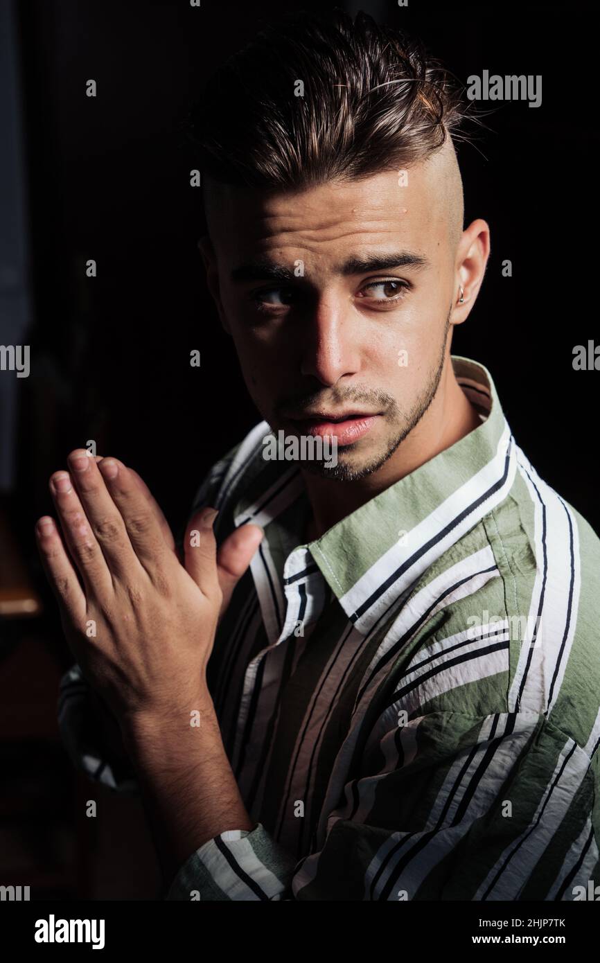 Handsome stylish Spanish man posing indoor Stock Photo - Alamy