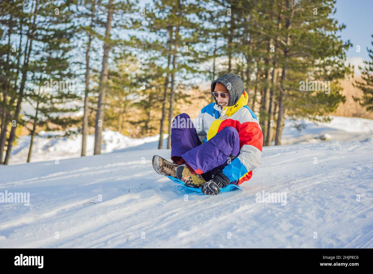Adult man sliding down slide hi-res stock photography and images - Alamy