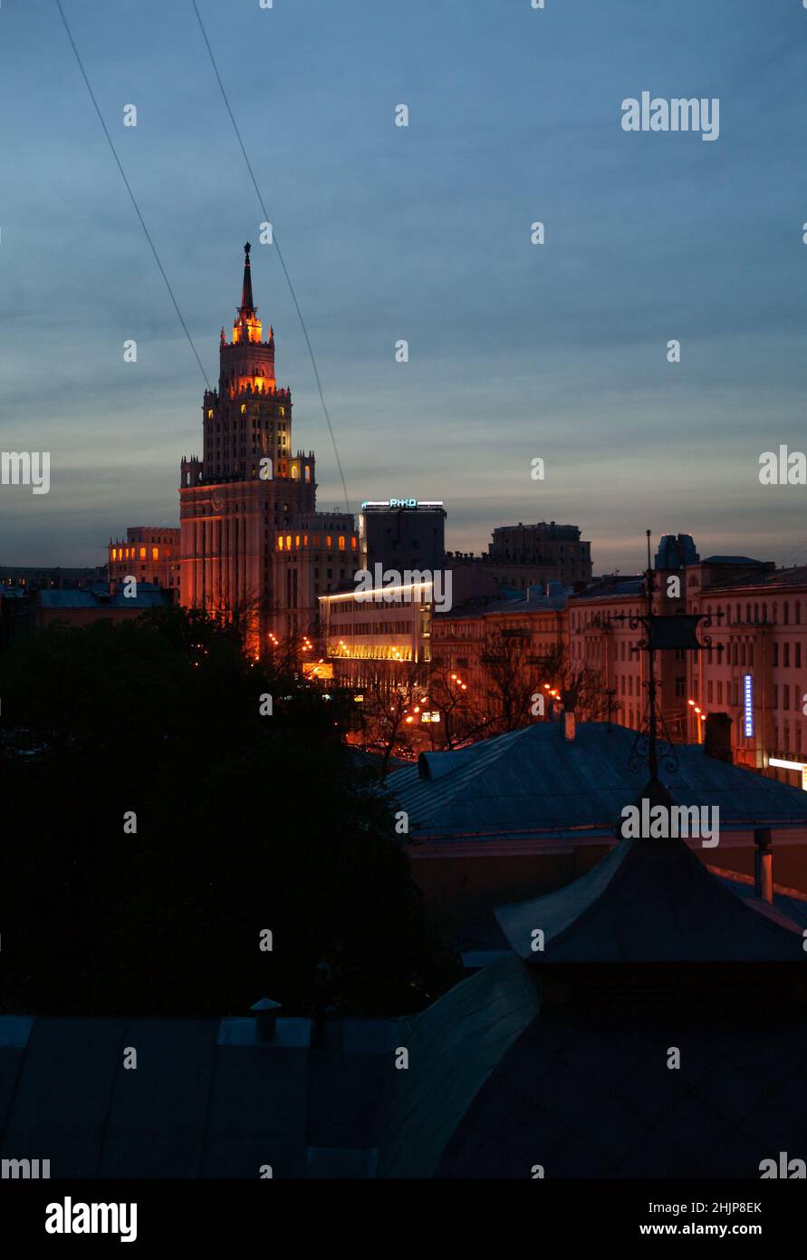 One of the Moscow Stalinist hi-rise building in evening illumination ...