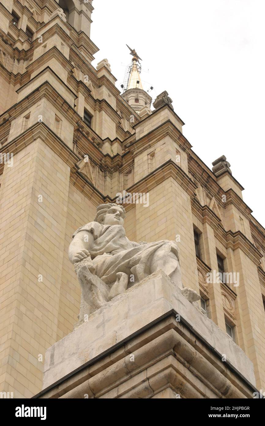 Child sculpture. Detail of high-rise Stalinist building on the ...