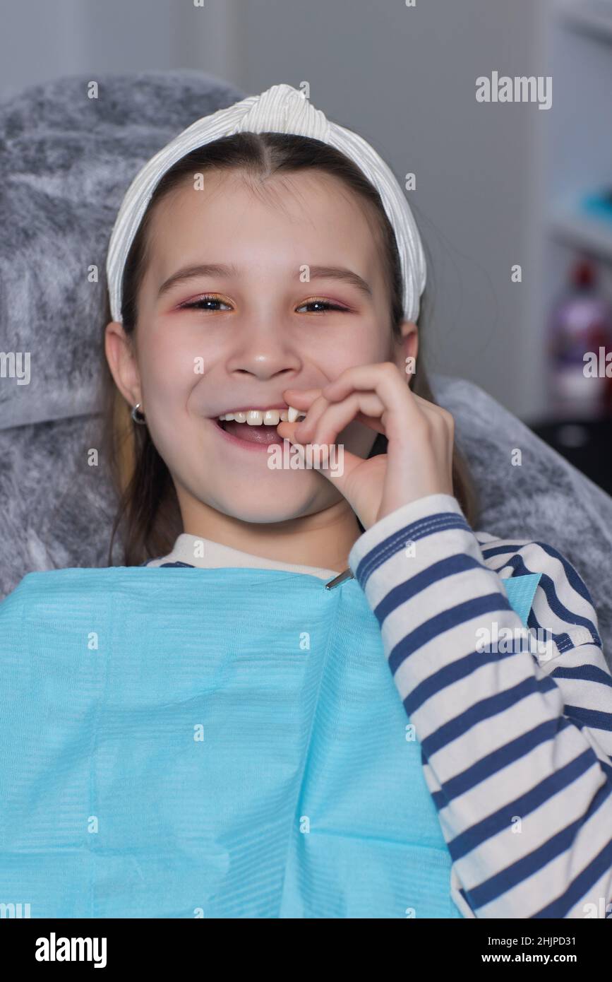 girl portrait with a lost tooth Teenager child with a tooth dropped out ...