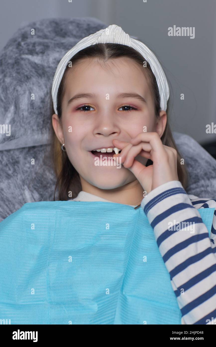 girl portrait with a lost tooth Teenager child with a tooth dropped out ...