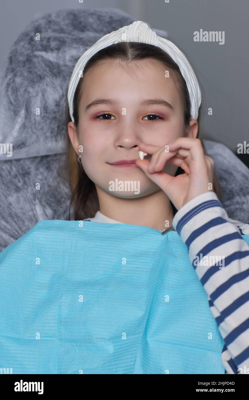 girl portrait with a lost tooth Teenager child with a tooth dropped out ...
