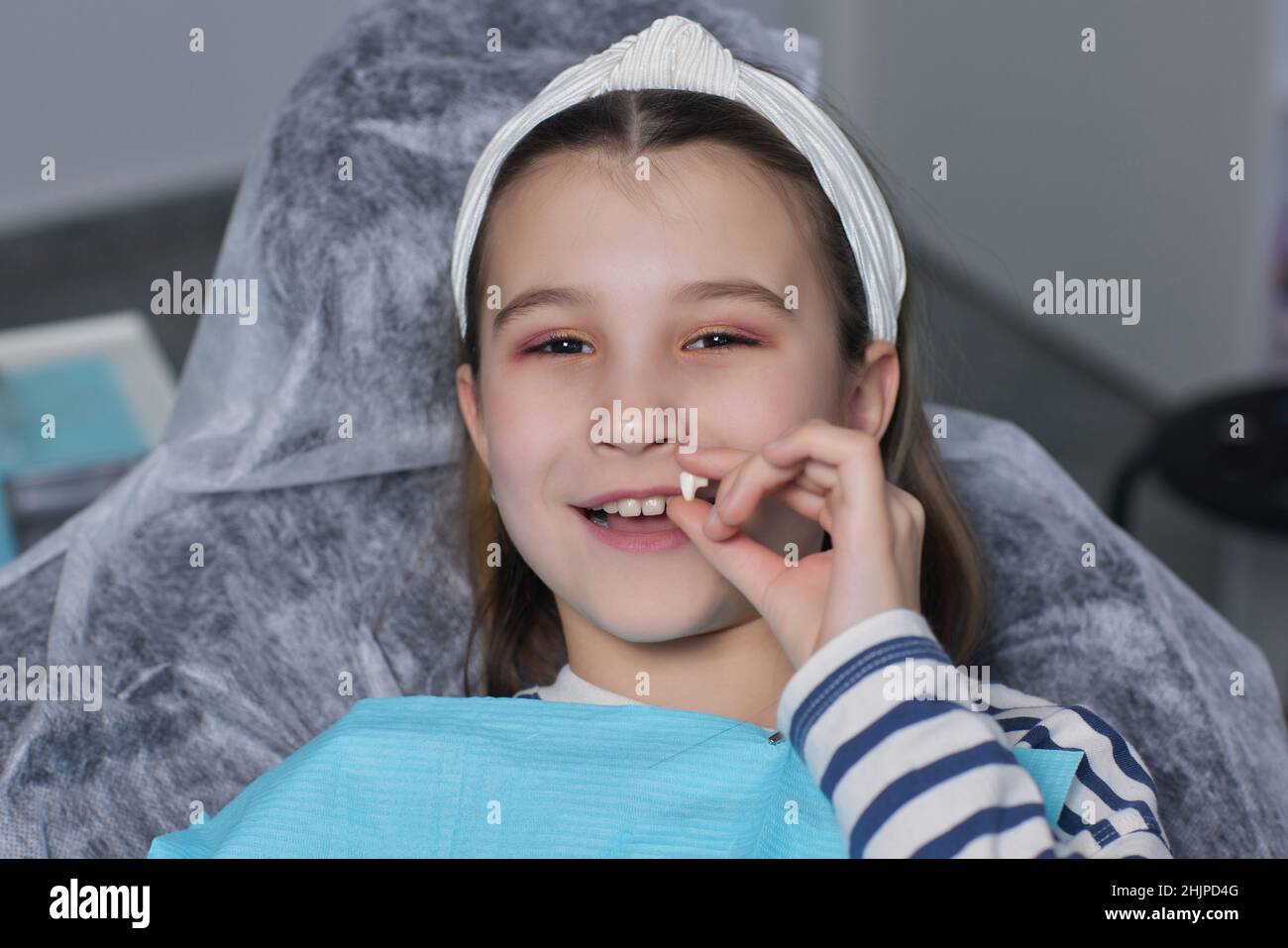 girl portrait with a lost tooth Teenager child with a tooth dropped out ...