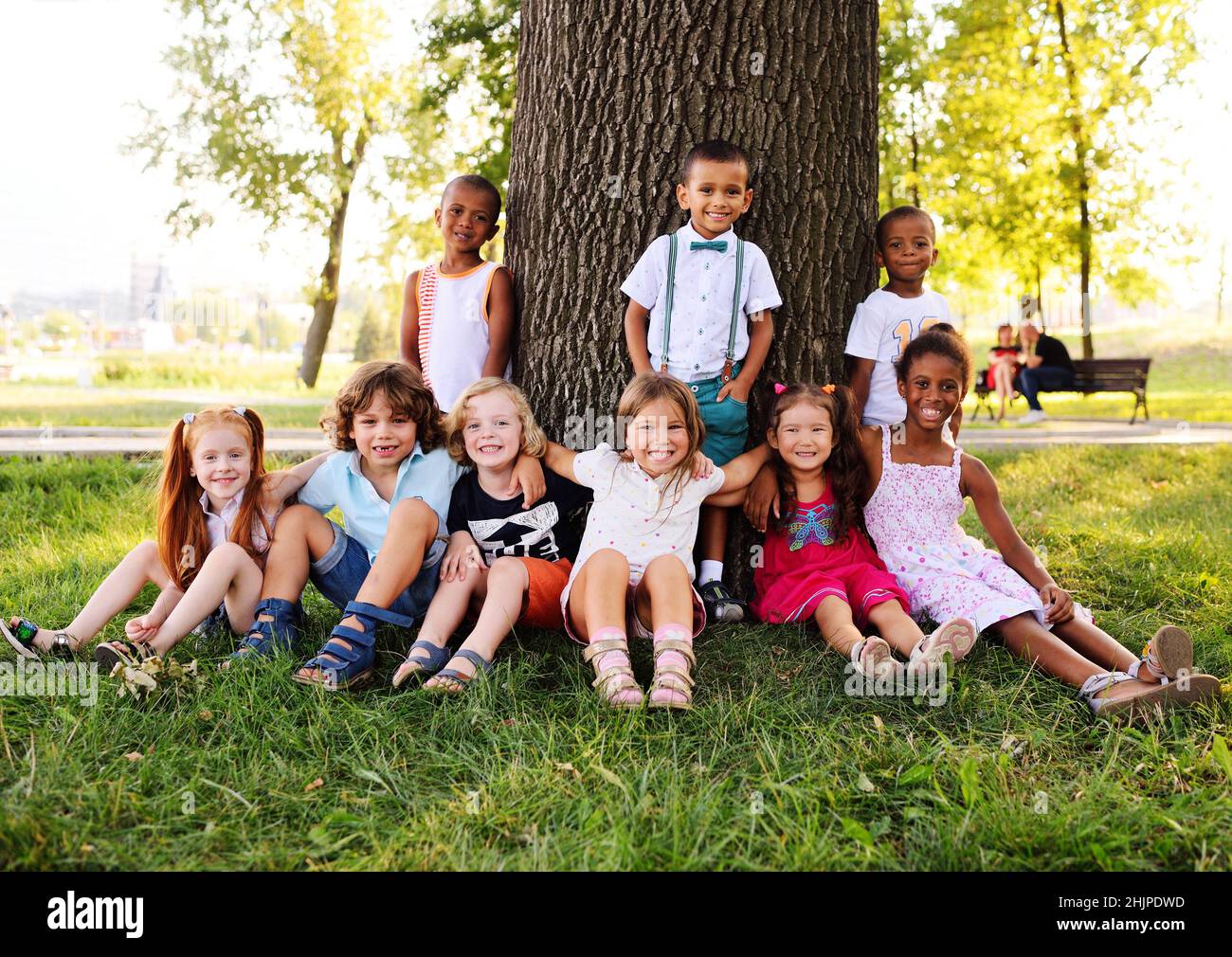 Children embracing a tree hi-res stock photography and images - Alamy