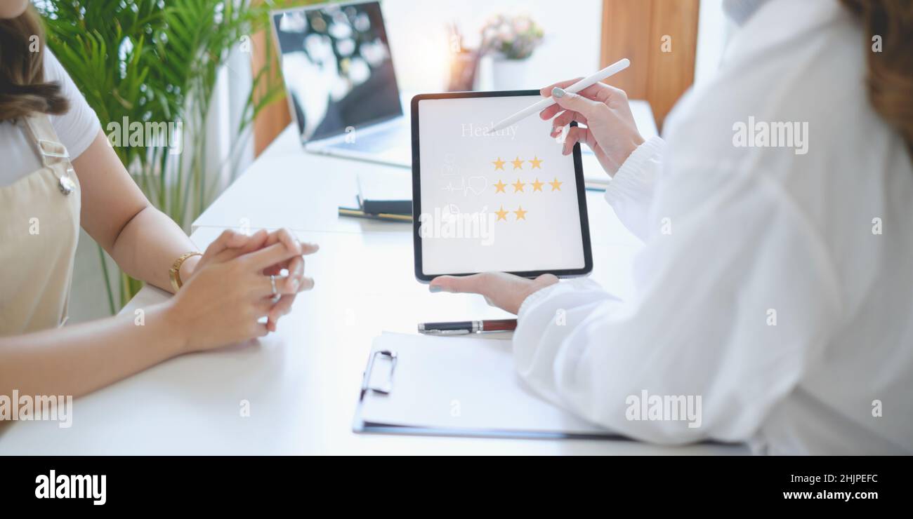 Doctor discussing and explain to patient about life plan. Medicine and ...