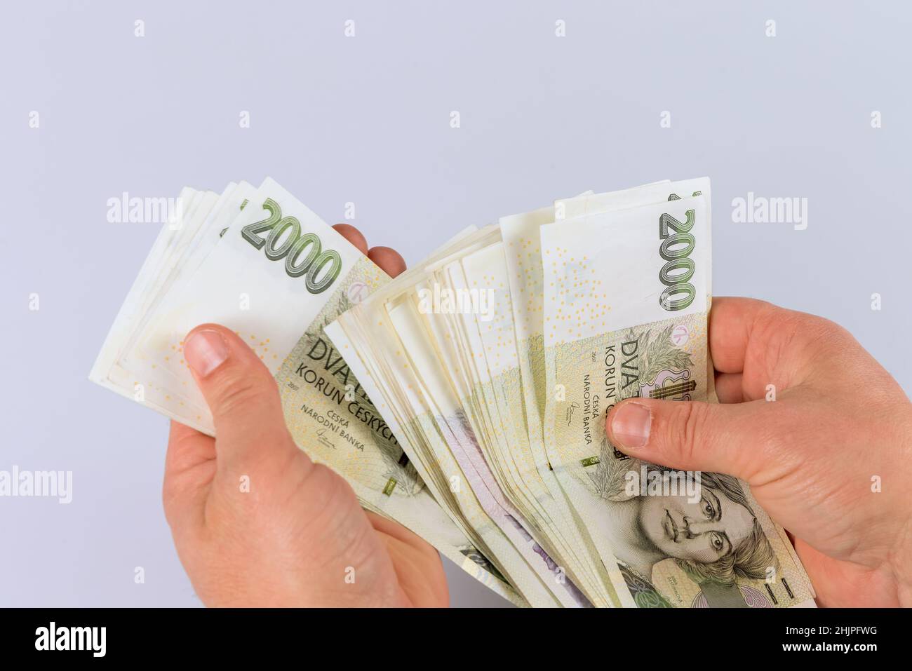 Czech koruna currency bills CZK banknote in hand is counting money ...