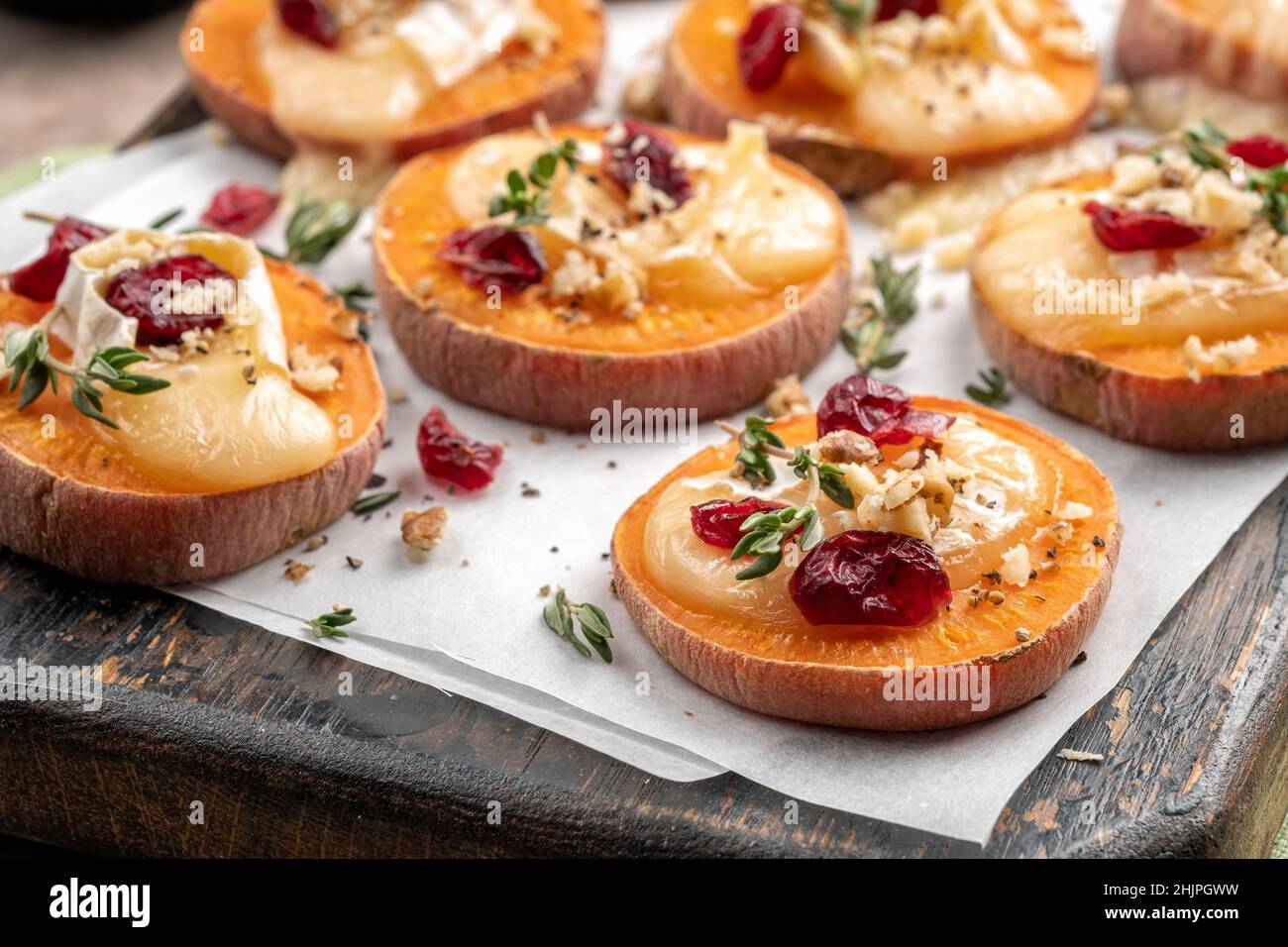 Baked Sweet Potato Rounds topped with brie cheese, cranberry and Walnut ...