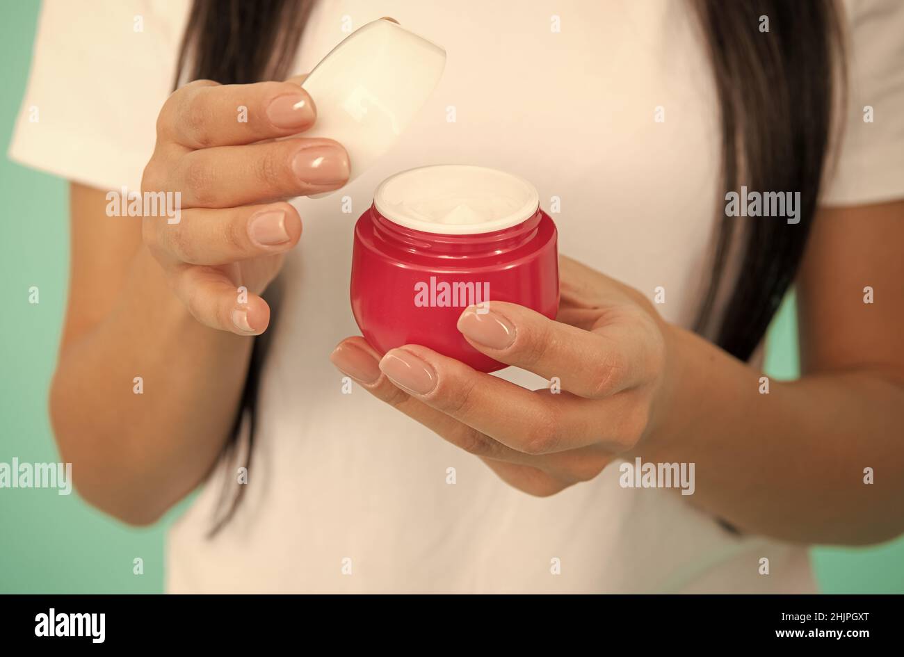 presenting cosmetic product for skin. open hand cream. hand manicure ...