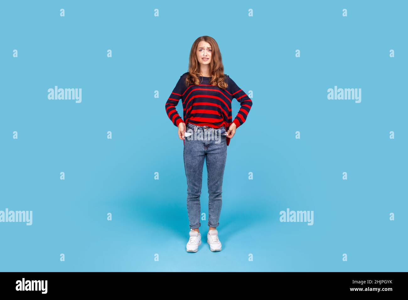 Woman with empty pockets hi-res stock photography and images - Alamy