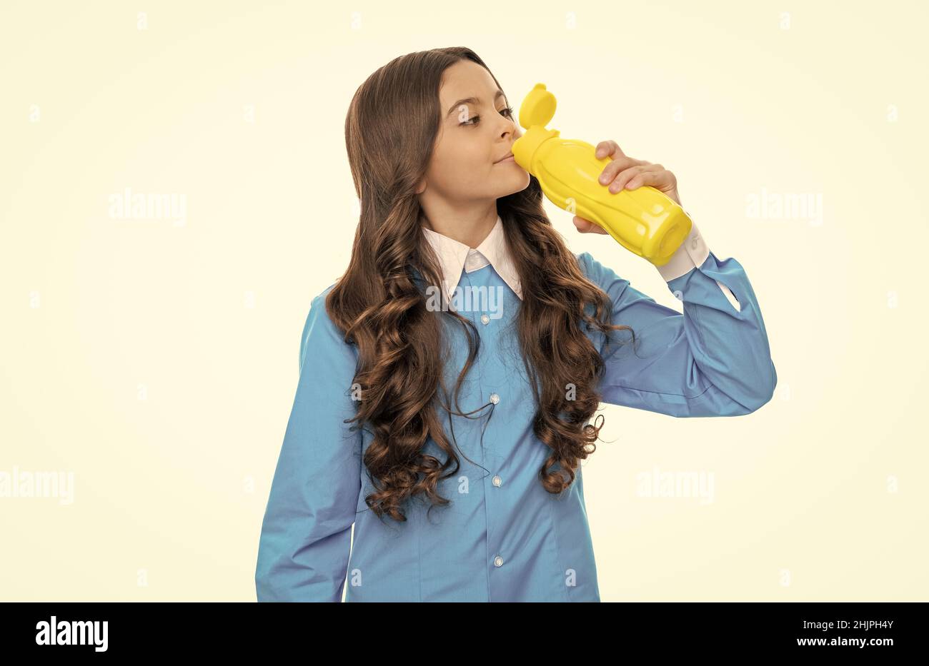 Taste and health put together. Little child drink from bottle. Yogurt ...