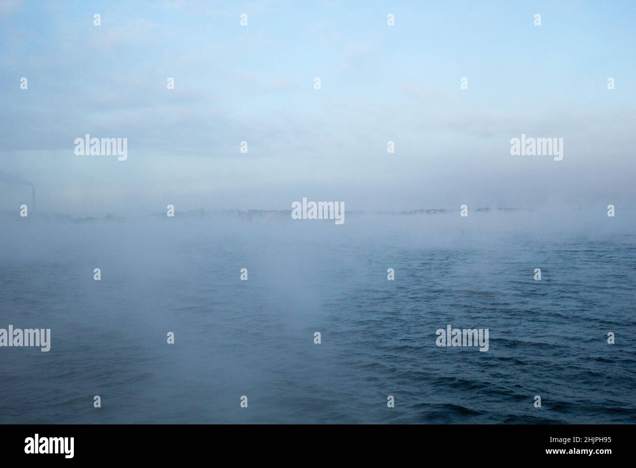 A boat sailing the fog Stock Photo - Alamy