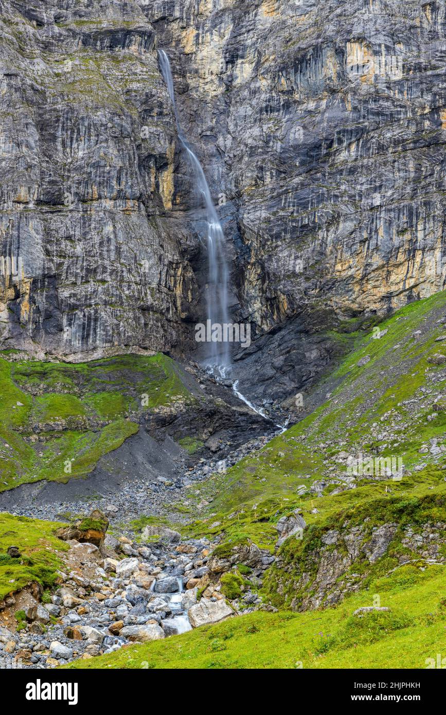 Typical alpine landscape with waterfalls, Swiss Alps near ...