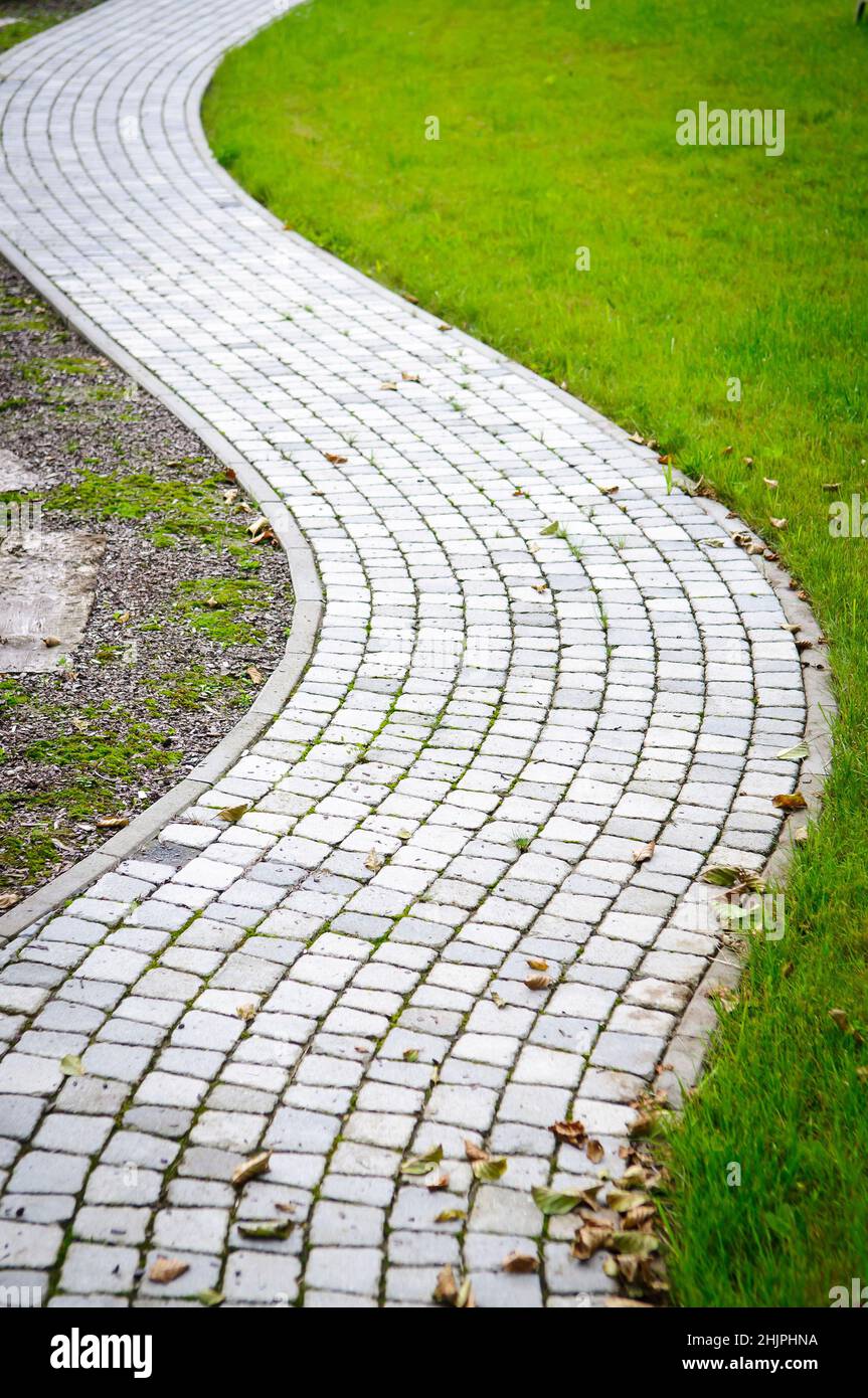 Empty cobbled garden alley in polish garden Stock Photo - Alamy