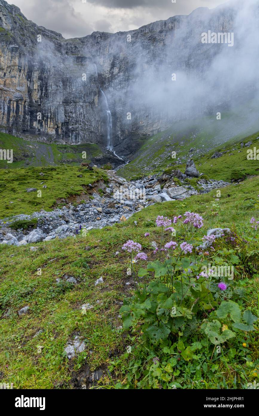 Typical alpine landscape with waterfalls, Swiss Alps near ...