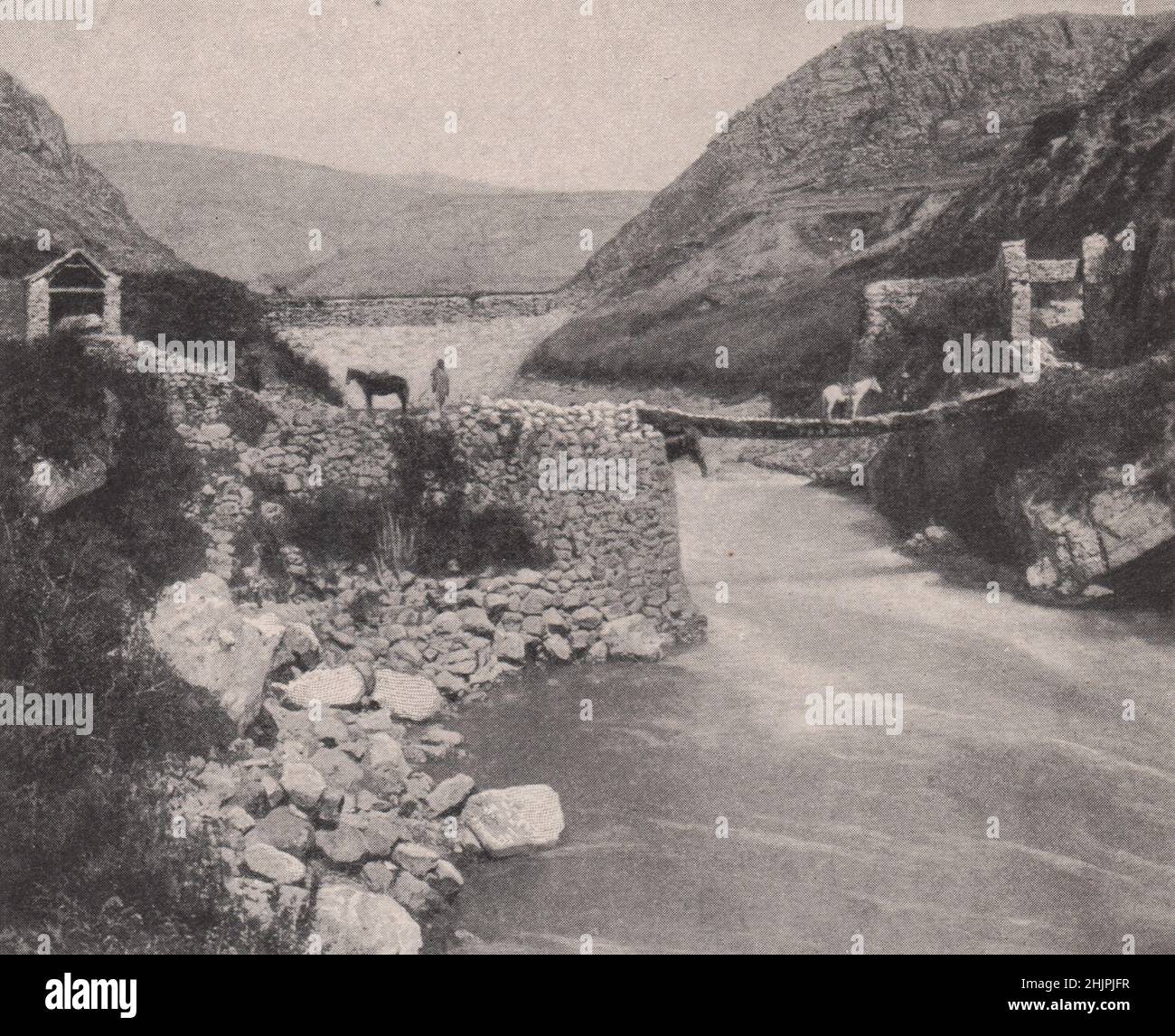 Giddy crossing of a roaring Andes torrent. Bolivia (1923 Stock Photo ...