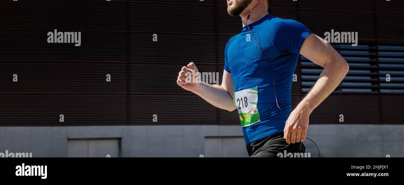 male athlete runner run in background dark wall Stock Photo - Alamy