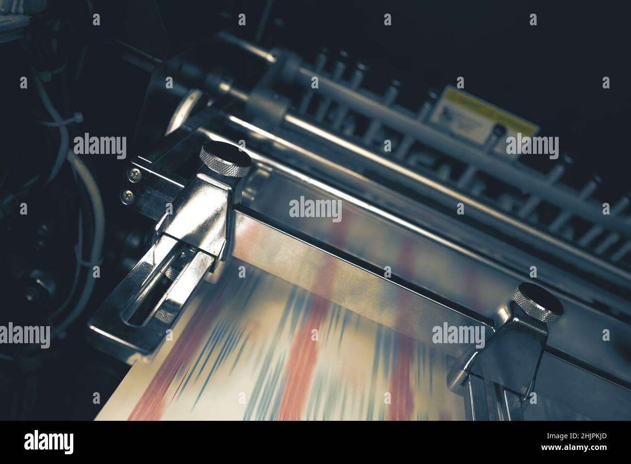 Printing press with blurred belt during printing process Stock Photo ...