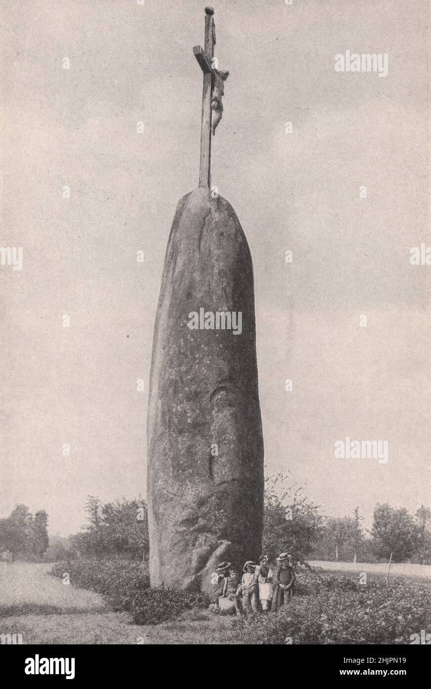 Christianity's emblem imposed upon a pagan monument. France. Brittany ...