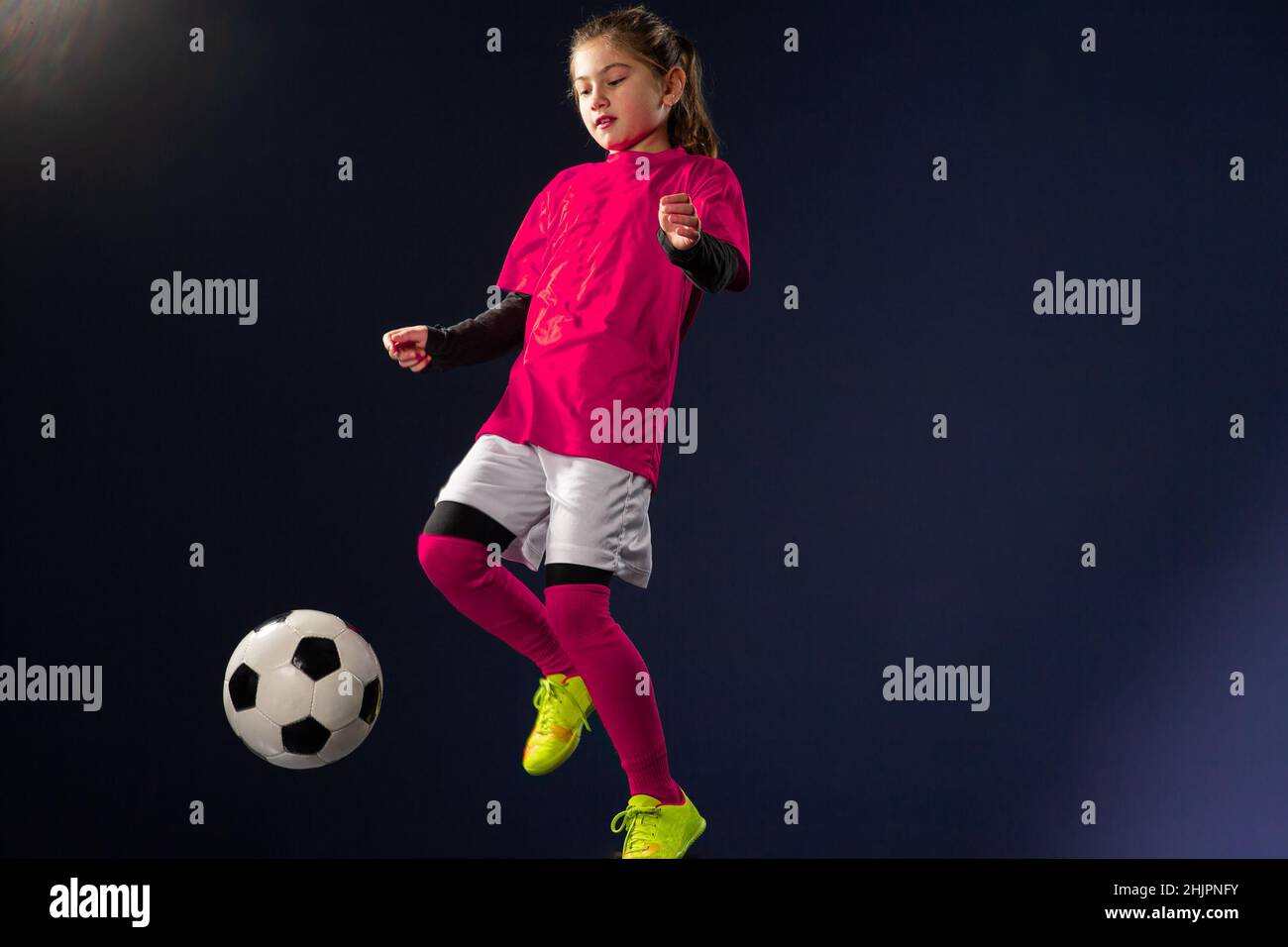 Girl kicks the ball hi-res stock photography and images - Alamy