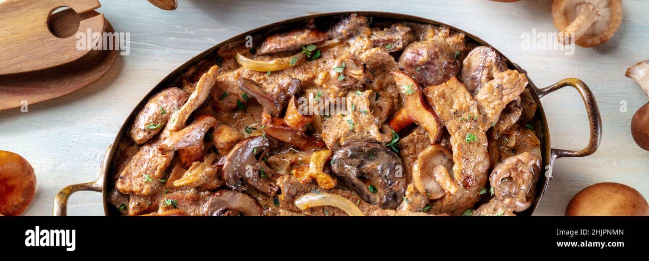 Mushroom beef stroganoff panorama. Meat with champignons, boletus and ...