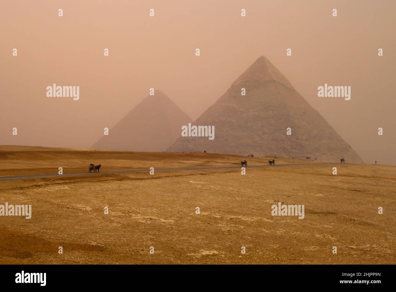 A beautiful warm and pinkish background travel image of many pyramids ...