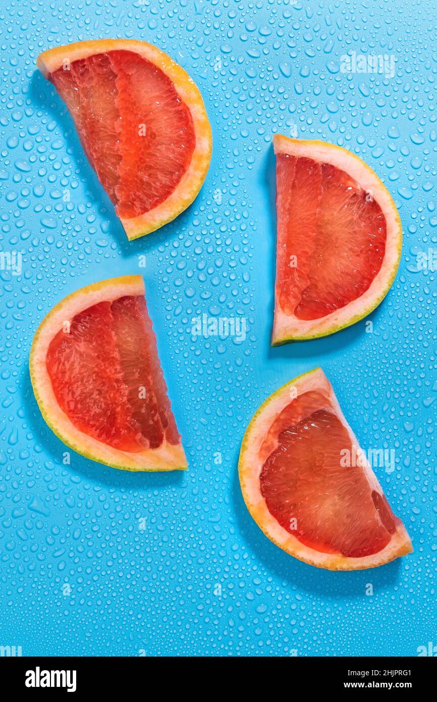 Grapefruit slice on pastel blue background. Minimal summer concept ...