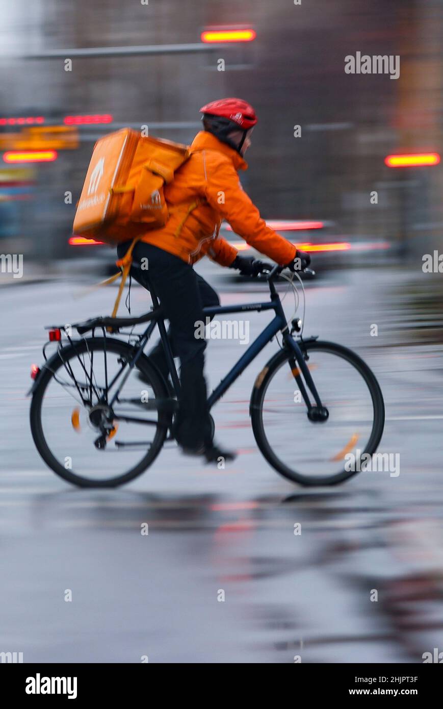 Leipzig, Germany. 31st Jan, 2022. An employee of the food delivery ...