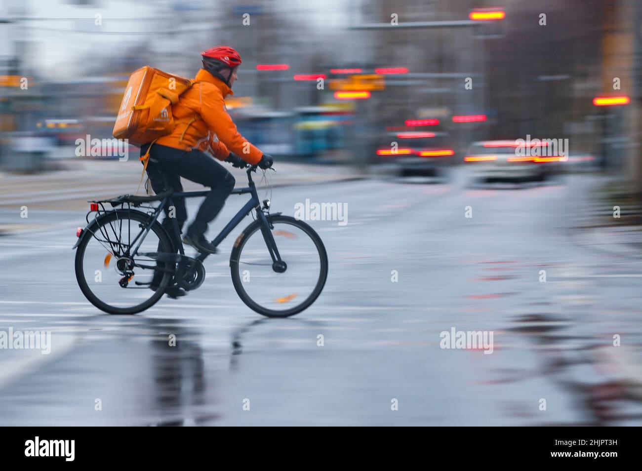 Leipzig, Germany. 31st Jan, 2022. An employee of the food delivery ...