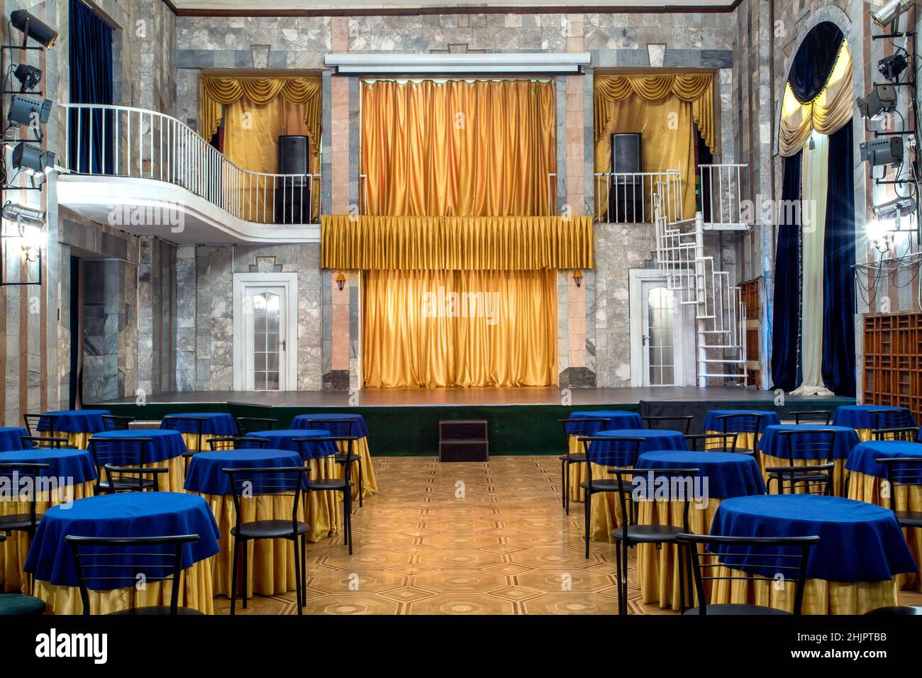 Image of a theater stage in front of tables in an empty café Stock ...