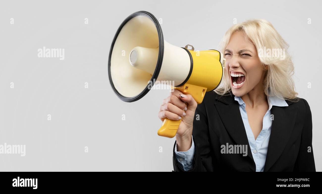 Angry irritated female businesswoman in formal wear screaming in ...