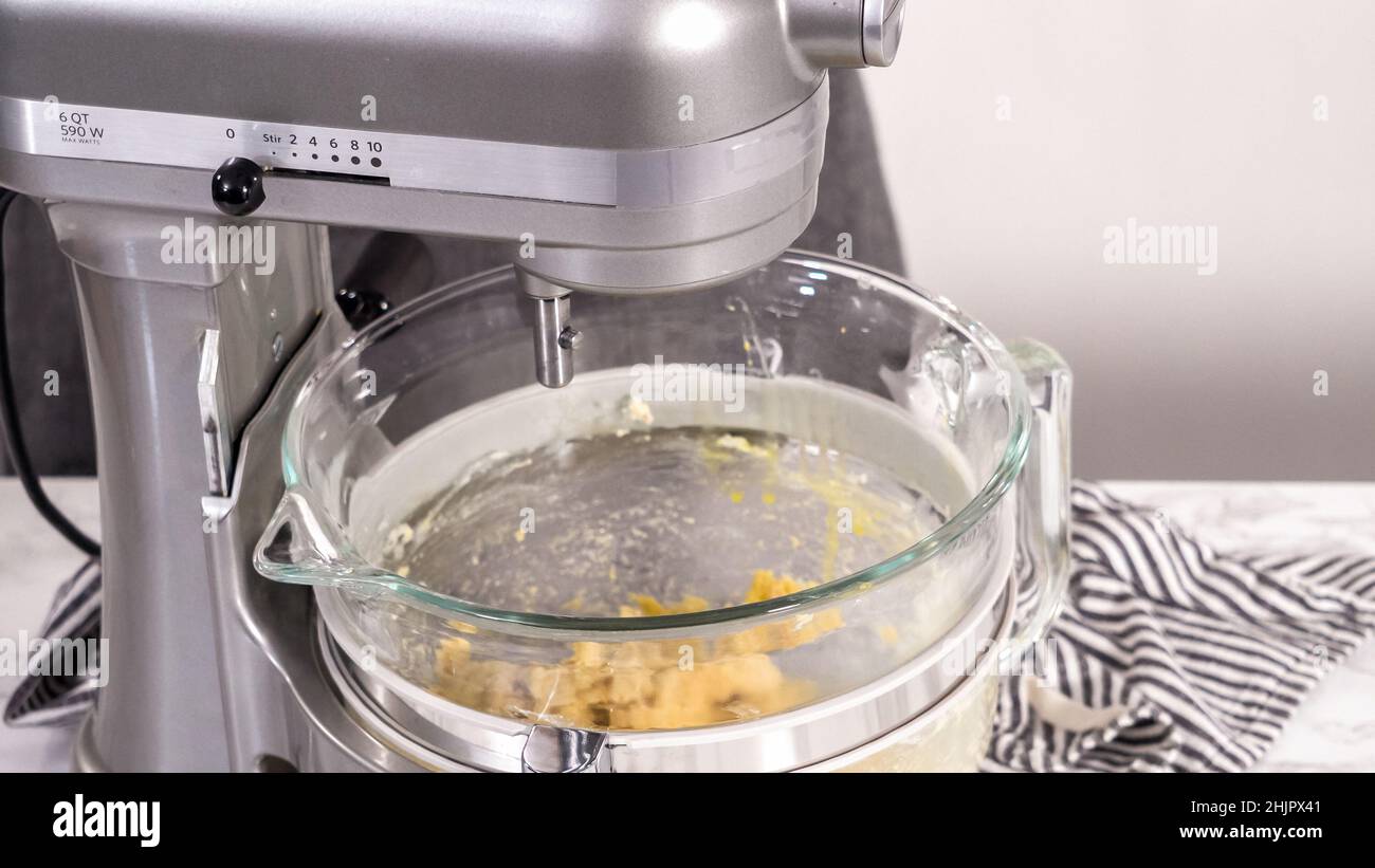 Step by step. Mixing ingredients in kitchen mixer to bake homemade ...