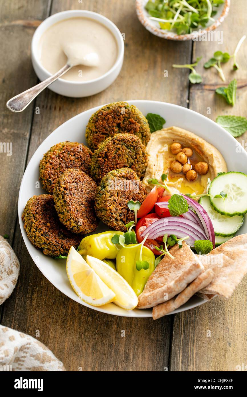 Baked falafel bowl with hummus and vegetables Stock Photo - Alamy