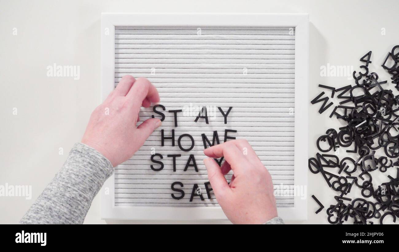 Flat lay. STAY HOME and STAY SAFE sign on a white message board Stock ...