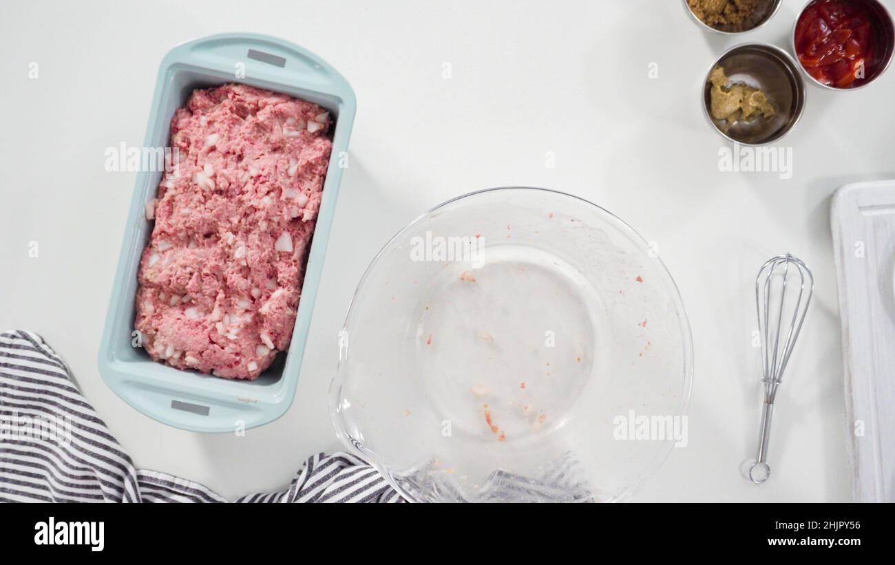 Flat lay. Step by step. Mixing ingredients for a classic beef meatloaf ...