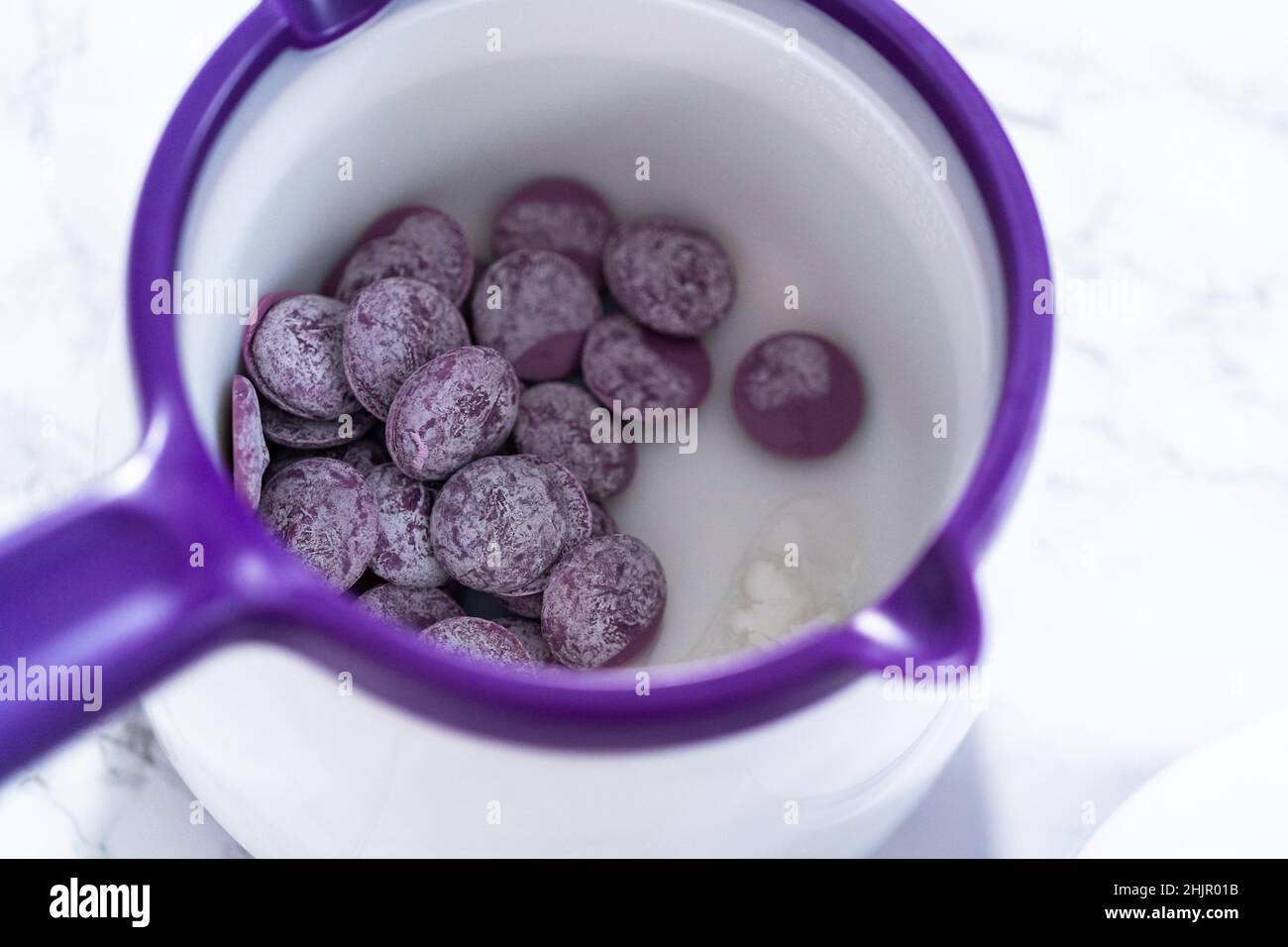 Melting chocolate chips in a candy melting pot to make chocolate ...
