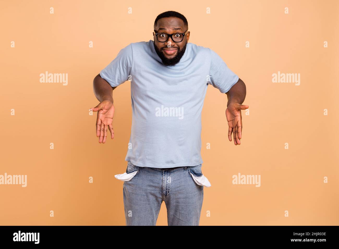 Photo of sad millennial beard guy poor wear eyewear blue outfit ...