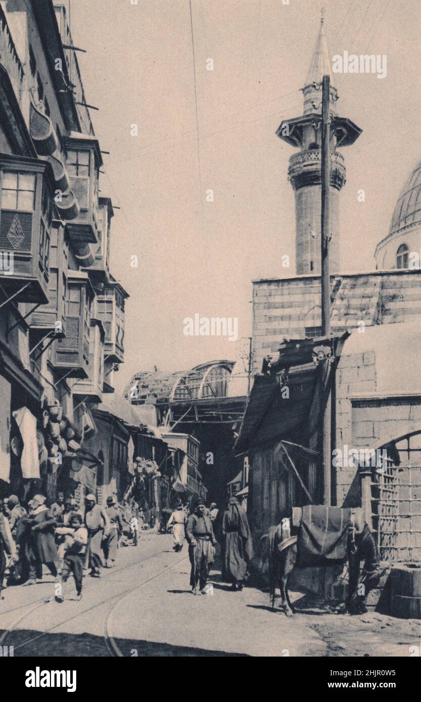 In the Vivid bustle of the cloth bazaar there is always a crowd ...