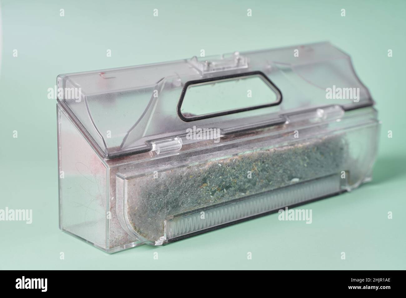 Transparent dust container of the robot vacuum cleaner after cleaning ...
