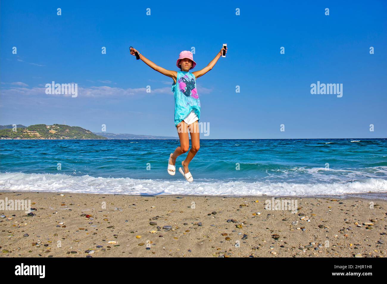 Woman beach jumping swimsuit hi-res stock photography and images - Alamy
