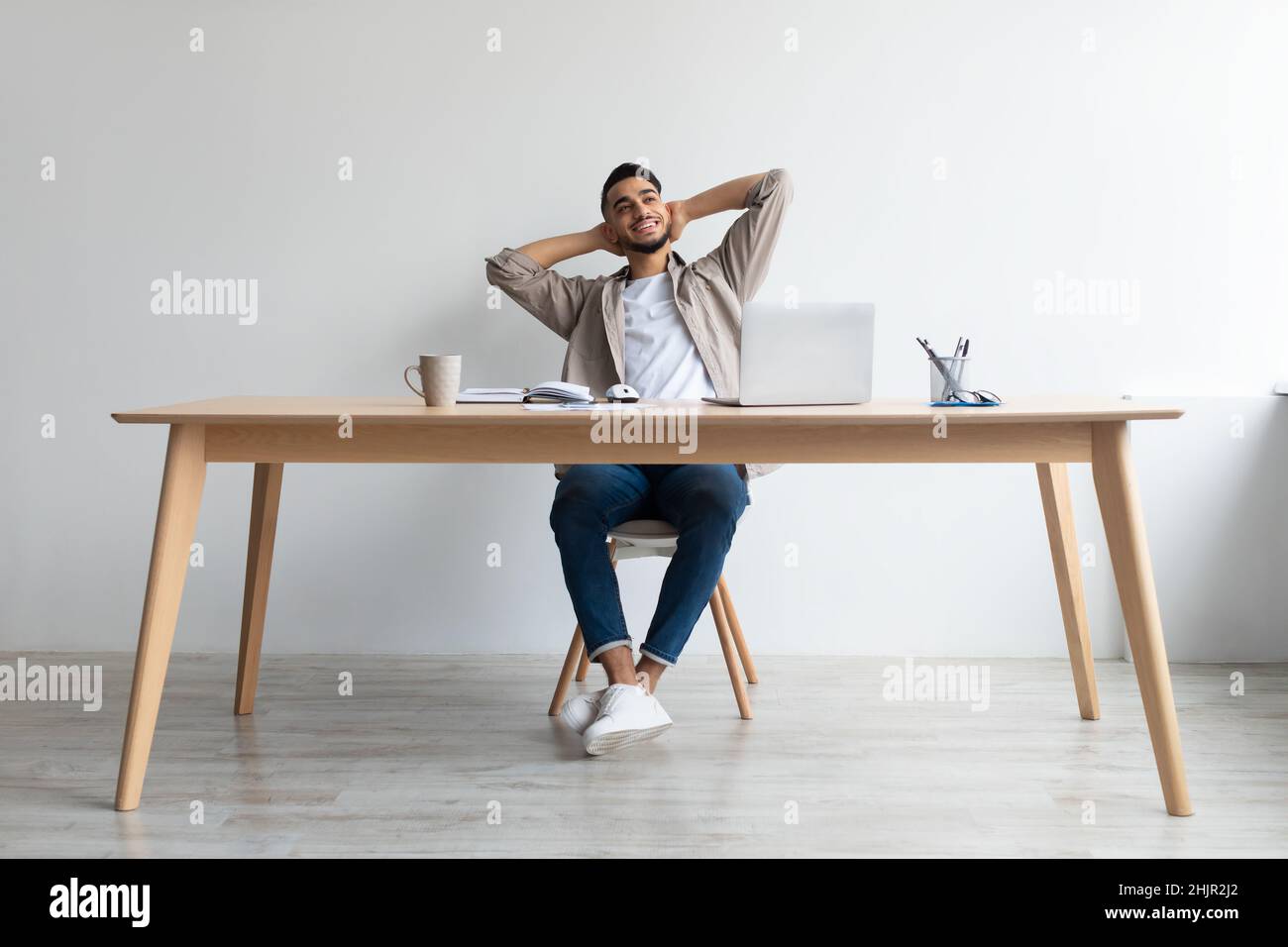 Businessman desk office leaning back hi-res stock photography and ...