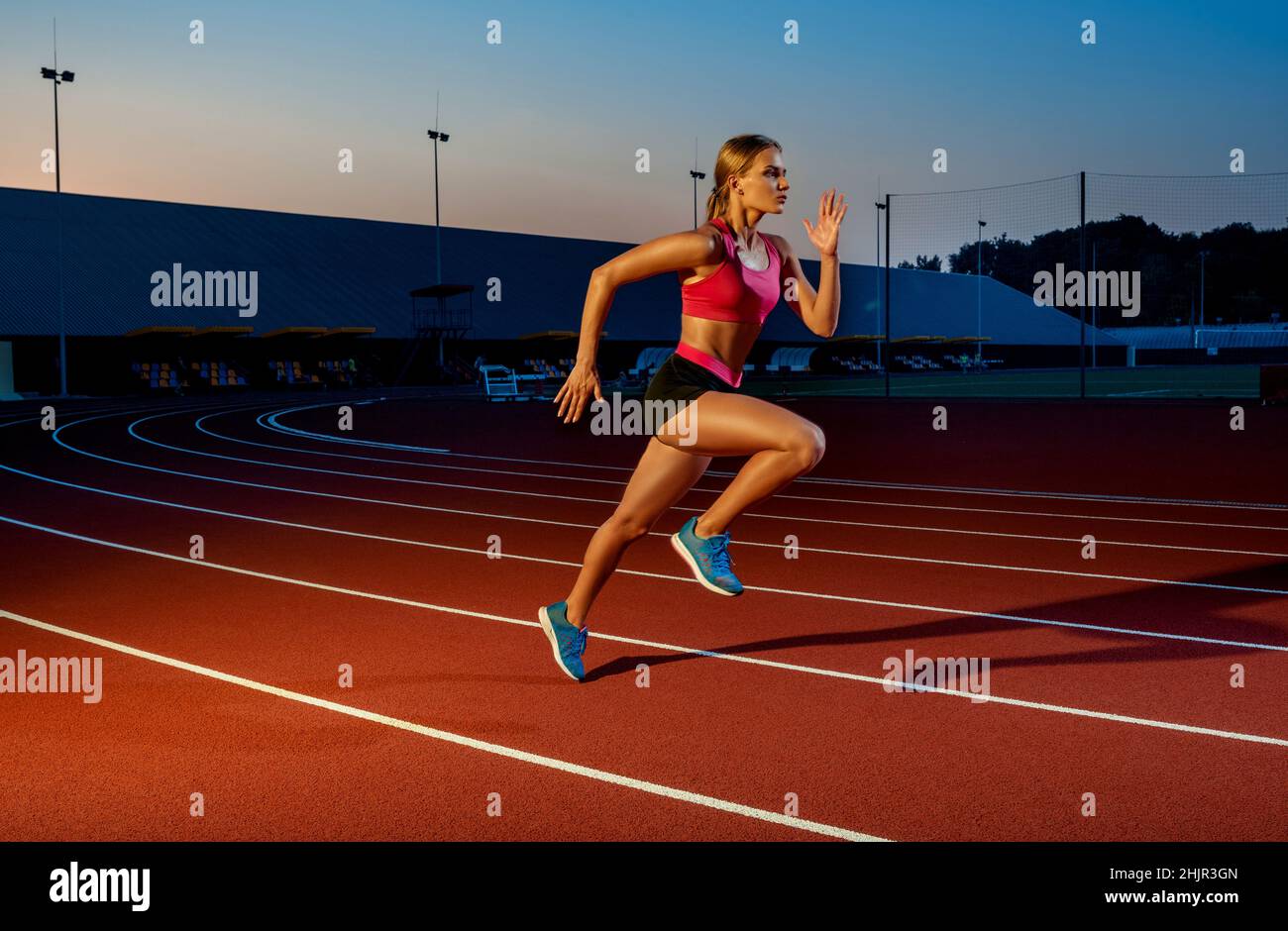 Runner sprinting towards success on run path running athletic track ...